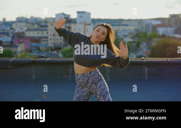 Skilled Female Hip-Hop Dancer Performs on a Rooftop, Mesmerizing the ...
