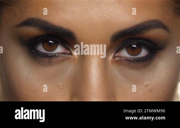 Girl opens her eyes and looks forward and closes his eyes. Close up ...