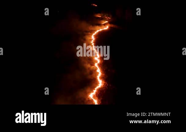 Night fire in the forest with fire and smoke.Epic aerial video of a ...