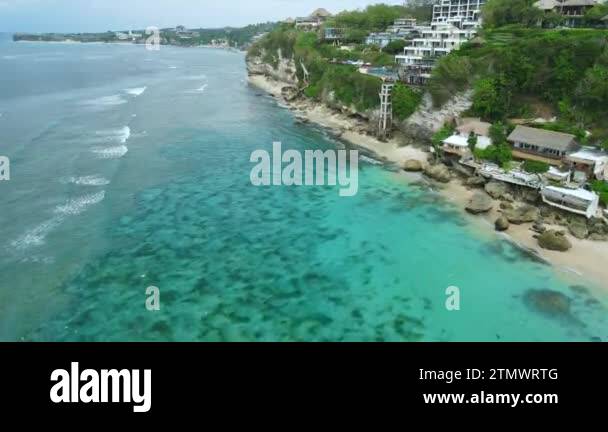 Ocean with pollution in water and luxury resorts in Bali. Pollution by ...