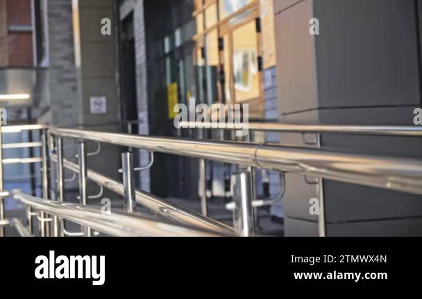 Metal handrails of ramp for people with disability at public center ...