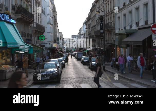 Typical French street in the Montmartre district with cafes ...