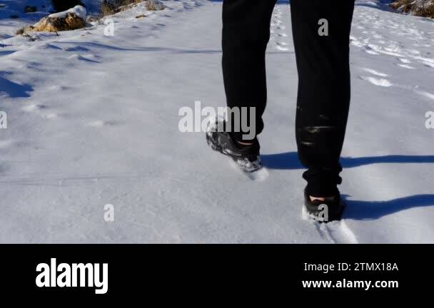 The traces left by the young man walking slowly on the snow, image ...