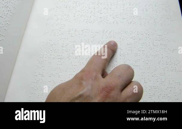 Blind person reading braille text close-up hand and fingers disability ...