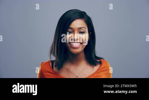 Thumbs up, excited and face of woman in studio for goal achievement ...