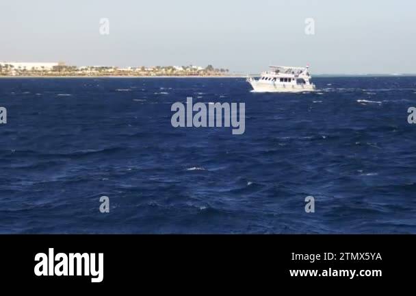 Pleasure Boat Floats on the Waves of the Red Sea on the Background of ...