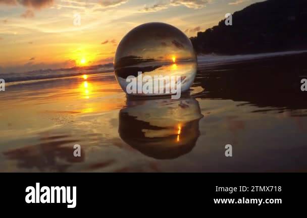 Place a crystal ball tilted against the horizon line.Ocean waves ...