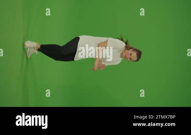Vertical Video. Female Dancer Performing a Dance on Green Screen ...