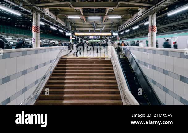 Timelapse of busy crowded Japanese people waiting and boarding train at ...