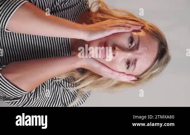 Vertical video. Sorrowful situation. Sad woman. Regrets depression ...
