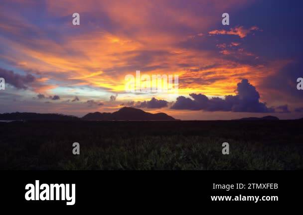 Time lapse amazing reflections of yellow sky above the coral reef at ...