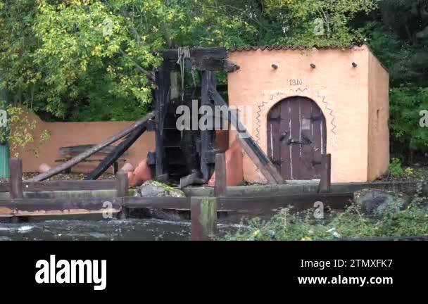 water spins the wheel of the hydroelectric power mill, water spins the ...