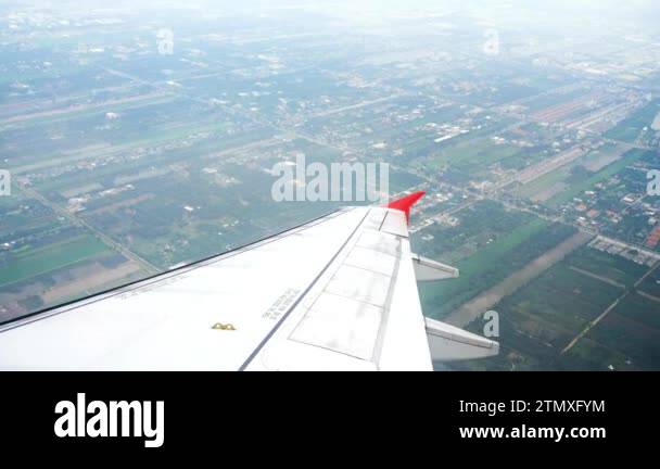 airplane window View of Beautiful city Cloud sky with plane wings for ...