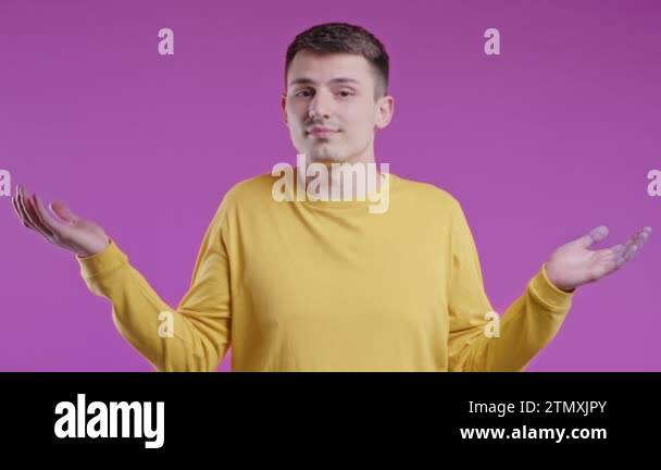 Confused man, shoulders up - cant help, makes gesture of I dont know ...