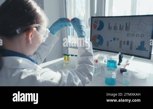 The video clip shows a scientist conducting genetic research in a ...