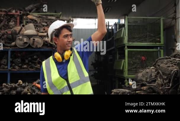 Asian man worker wears uniforms engineering greeting colleagues gives a ...
