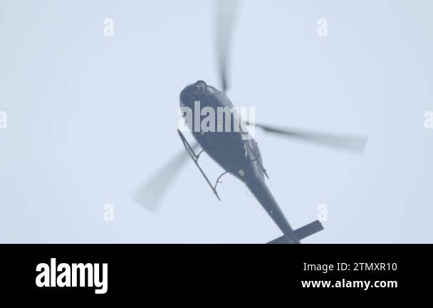 Helicopter flying in the sky low angle shot footage. Helicopter in ...