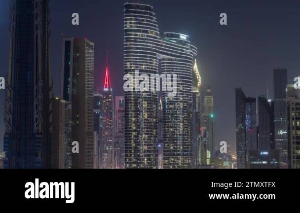 Futuristic towers and illuminated skyscrapers with lights in windows in ...