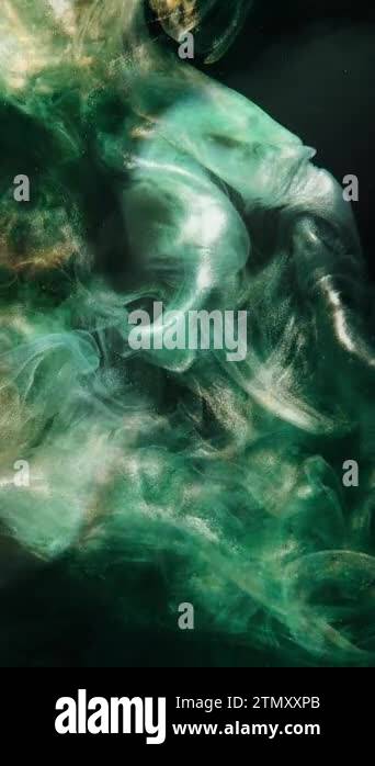 Vertical video. Ink water. Glitter fluid. Underwater splash. Abyss void ...