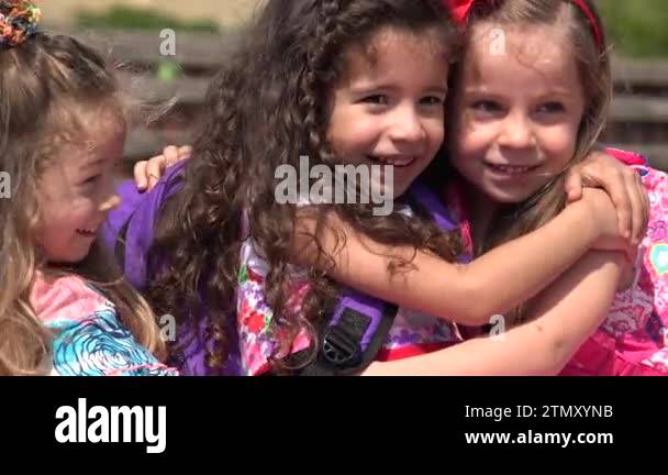 Kids Hugging Friends Stock Video Footage - Alamy