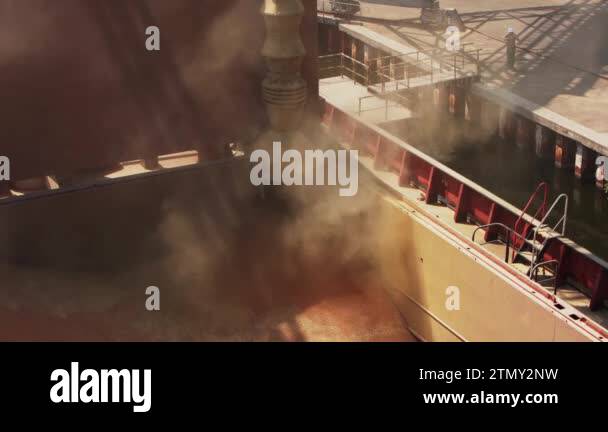 Grain loading to bulker ship cargo container at sea grain terminal in ...