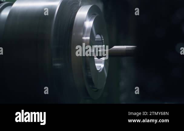 Close up shot of turning milling machine spinning and cutting basic ...