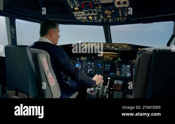 pilot pressing the gas pedal in the cockpit of jet plane during a ...