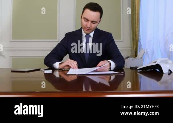 Pensive businessman sign documents turning over the sheets Stock Video ...