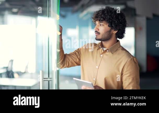Young creative entrepreneur business man in office uses post papers ...