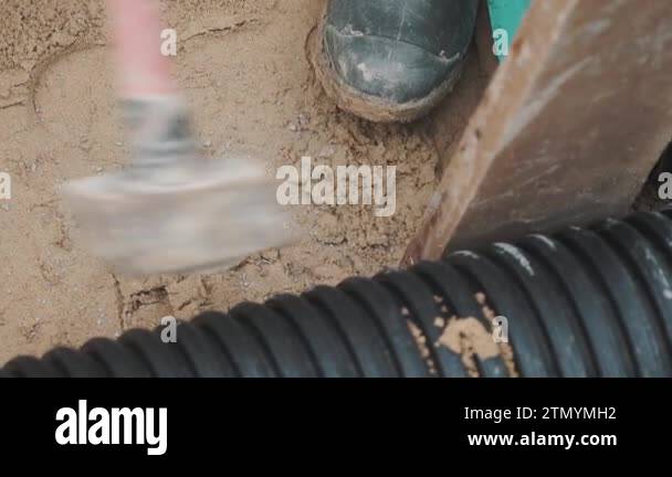 Slowmotion sledgehammer hitting piece of wood stuck between two plastic ...