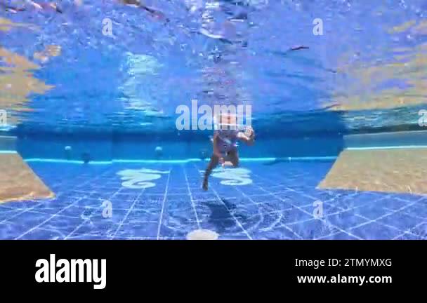 Little children sister triplets 4 years old play in the pool and on the ...