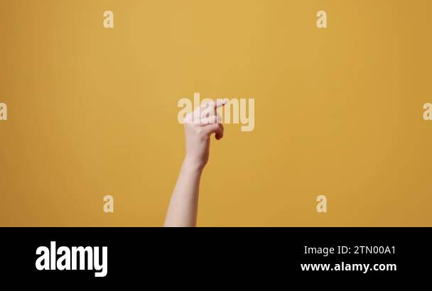 Crop female counting with raised arm. Static shot of anonymous woman ...