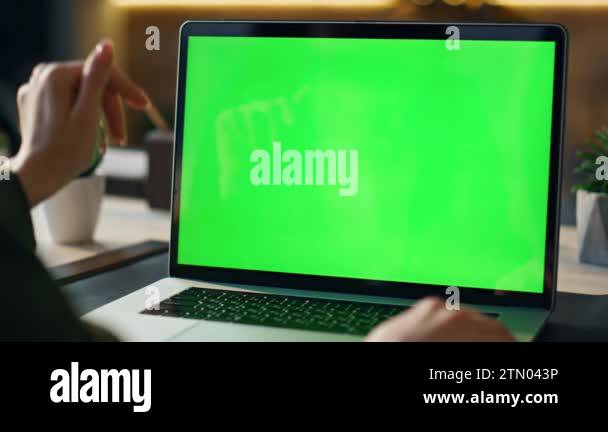 Greenscreen laptop user videocalling sitting office desk close up ...