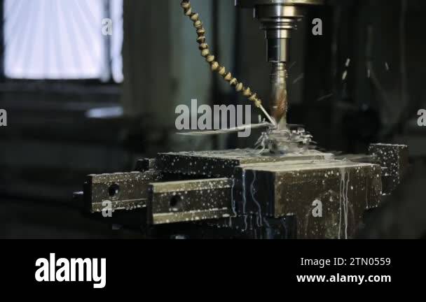 Drilling on lathe with coolant through tube Stock Video Footage - Alamy