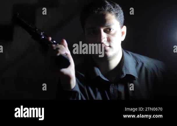 Cinematic shot of a mafia boss or a hitman sitting on a table in a ...