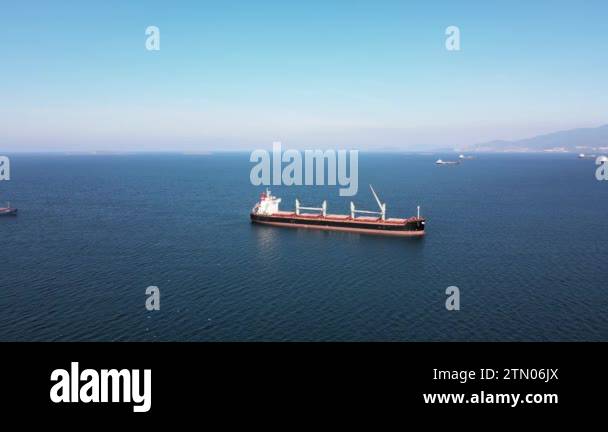 Dry cargo ship on bulk vessel anchored in anchorage waiting loading in ...