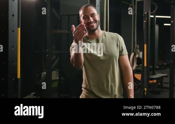 Smiling personal trainer showing his muscle Stock Videos & Footage - HD ...