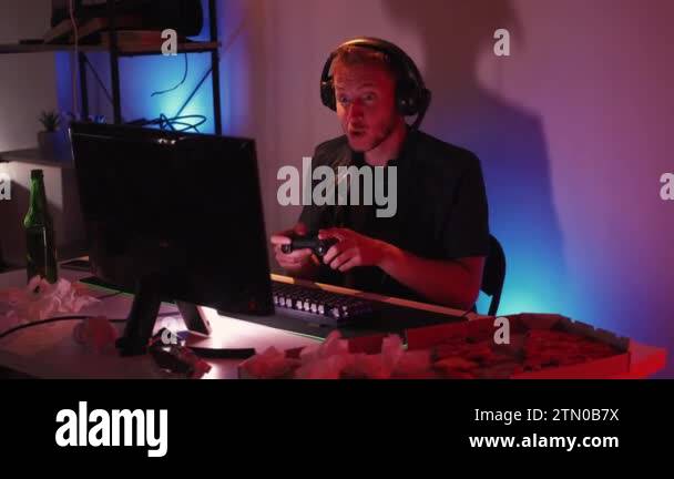 Game over. Cyber competition. Upset disappointed male gamer in ...