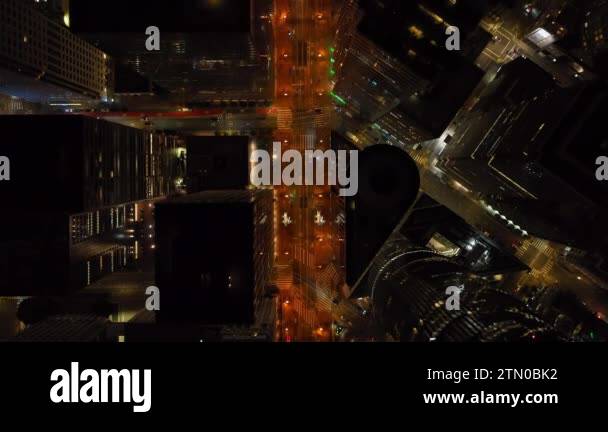 Cars passing through streets and intersections in night city. Top view ...