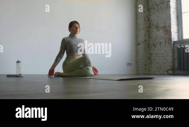 Powerful sense of empowerment as a yogi embraces the Cows Head Pose ...