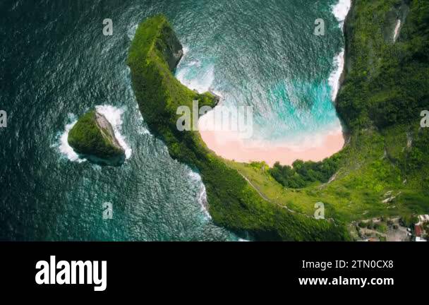 Exotic island on coastline of Nusa Penida Bali Indonesia. Green ...