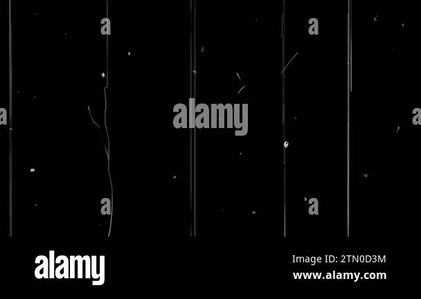 Animation of an old film with white lines and dots on a black screen. Stock retro clip with ...
