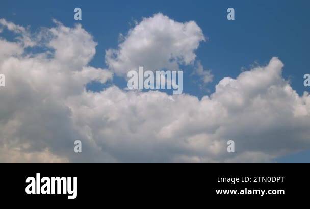 Blue sky white clouds. Puffy fluffy white clouds. Cumulus cloud cloudscape timelapse. Summer ...