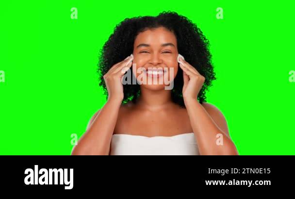 Face, green screen and woman with beauty, cotton pad and skincare ...