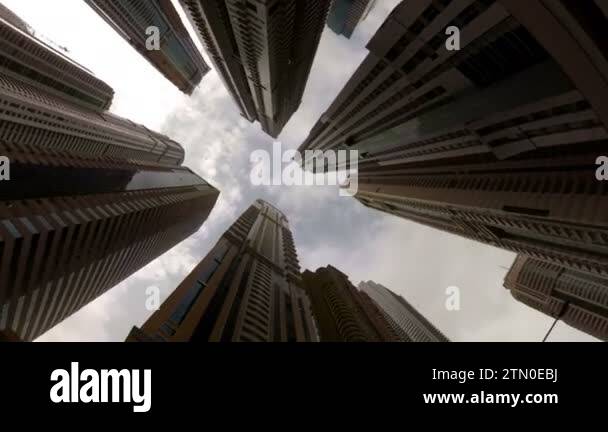 clouds float between the high-rise buildings in Dubai, UAE Stock Video ...