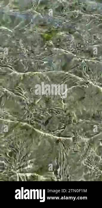 Sunbeams create ripples on the water this is the low tide in the ...