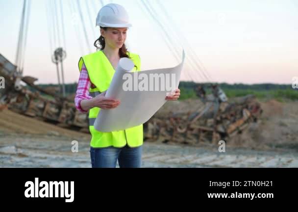 Female worker stands with drawings on a of career Stacker Stock Video ...