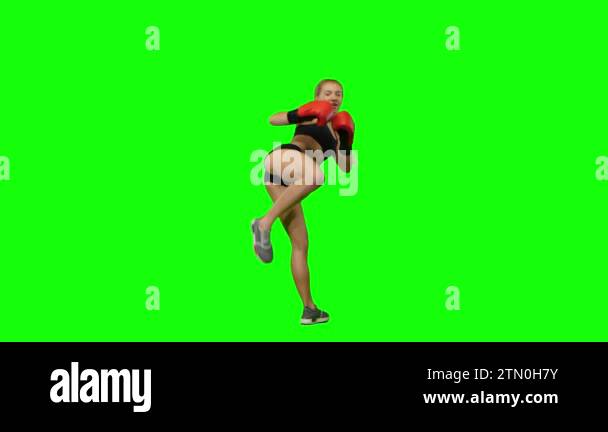 Boxer standing in the front and make swings and kicks. Green screen ...