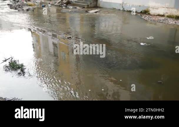Waste, trash and garbage floated on a polluted Hyderabad City Roads ...