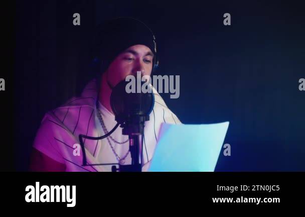 Man reading the text from the script and recording a voiceover for ...